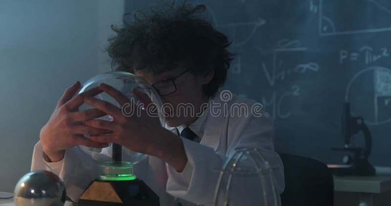 Schoolboy Experimenting in Physics Class. Young Student Doing Physics ...
