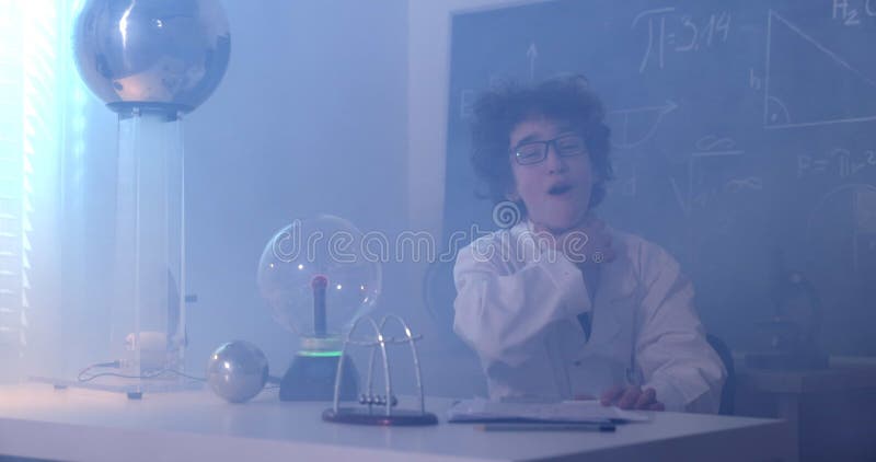 Schoolboy Experimenting in Physics Class. Young Student Doing Physics ...