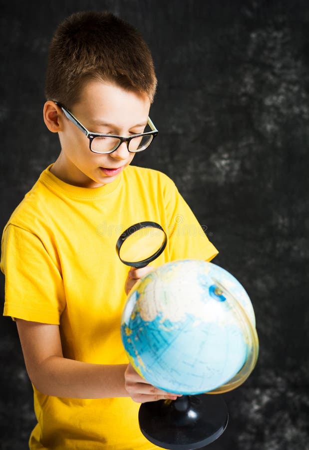 Schoolboy Exploring World through a Globe Stock Image - Image of ...