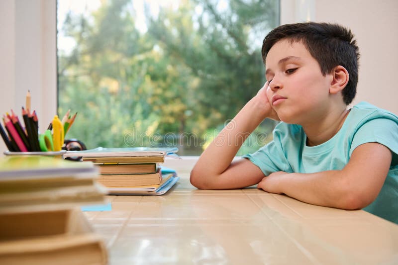 Schoolboy Feeling Tired while Doing Homework, Has Learning Difficulties ...