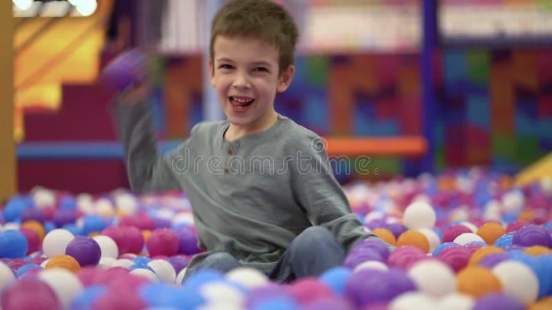 Schoolboy Has Fun in the Entertainment Center Playing with Plastic ...