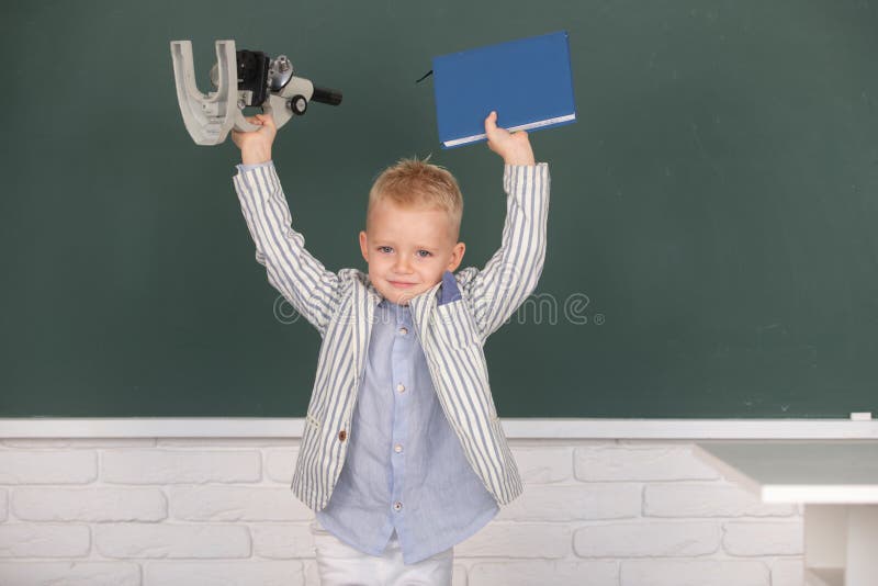 Schoolboy with Microscope and Book. School Boy Studying Math on Lesson ...