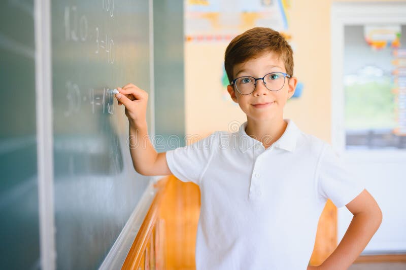 Schoolboy Near Blackboard in Classroom Stock Image - Image of hand ...