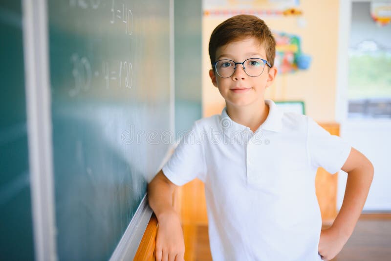Schoolboy Near Blackboard in Classroom Stock Image - Image of child ...