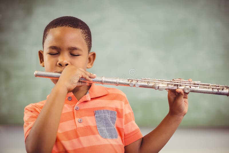 Schoolboy Playing Flute in Classroom Stock Photo - Image of academic ...