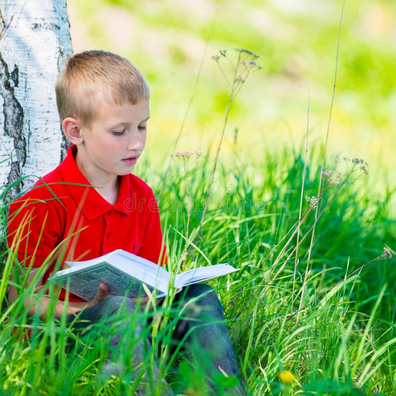 Schoolboy Reading the Book at Nature Stock Image - Image of clever ...