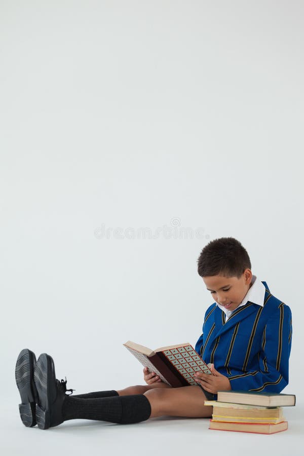 Schoolboy Reading Book on White Background Stock Photo - Image of ...