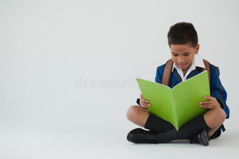 Schoolboy Reading Book on White Background Stock Photo - Image of ...