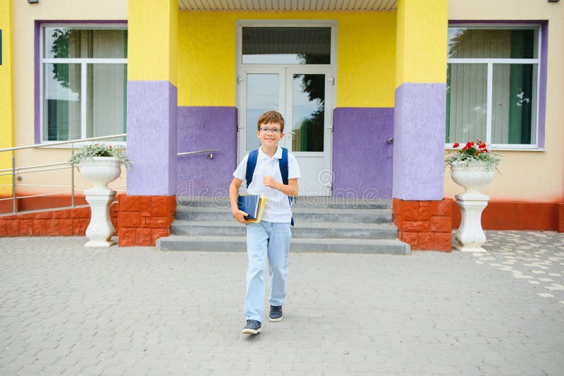 Schoolboy Runs Out of School Stock Photo - Image of child, primary ...