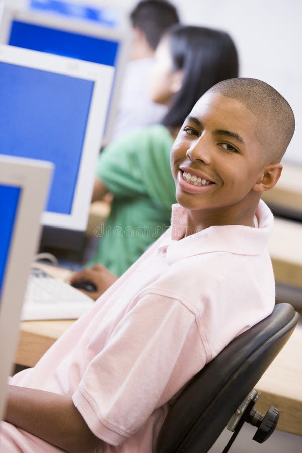 Schoolboy Sitting in Front of a Computer Stock Photo - Image of looking ...
