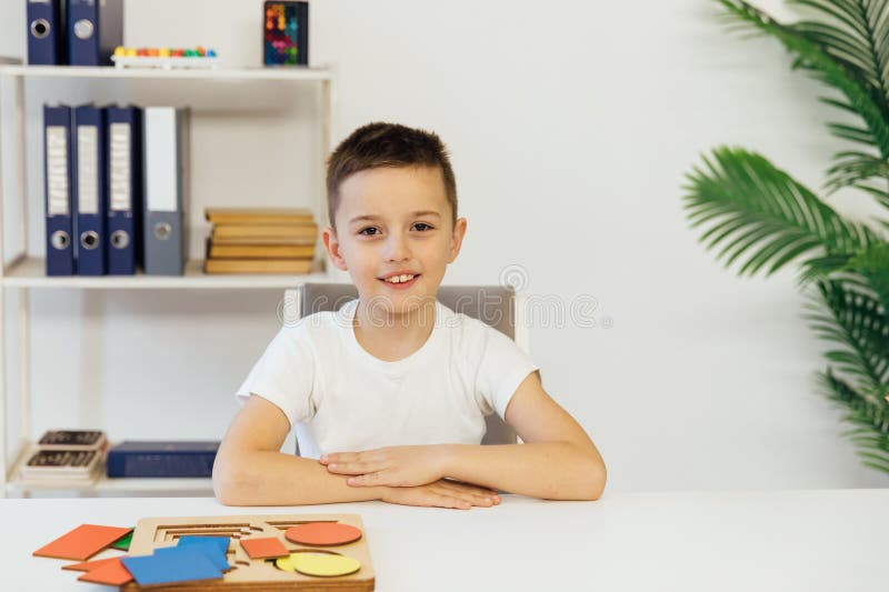A Schoolboy Sitting at a Table in a Lesson Stock Image - Image of small ...
