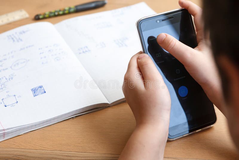 Schoolboy with Smartphone Doing Homework at Home Stock Image - Image of ...