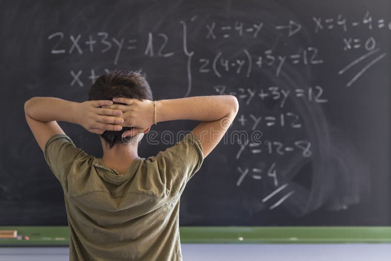 Schoolboy Solving a Problem on a Blackboard. Stock Image - Image of ...