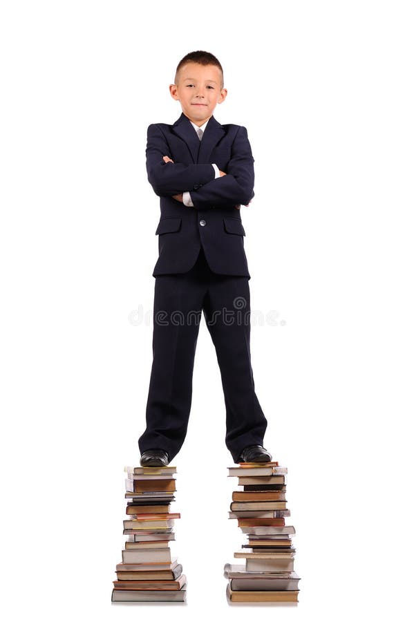 Schoolboy Standing on the Huge Stack of Books Stock Image - Image of ...