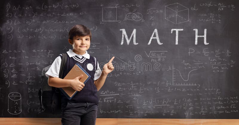 Schoolboy in a Uniform with Books Pointing To a Blackboard with Math ...
