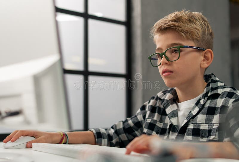 Schoolboy Using Computer in Classroom at School Stock Image - Image of ...