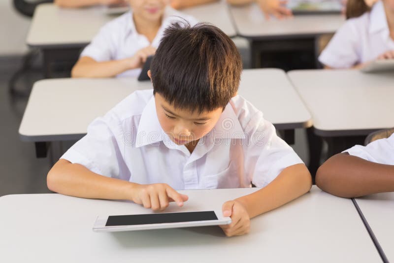 School Kids Using Digital Tablet in Classroom Stock Image - Image of ...