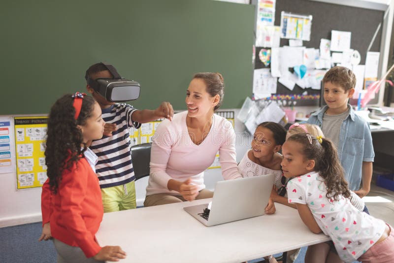 Schoolboy Using Virtual Reality Headset at School in Classroom with His ...