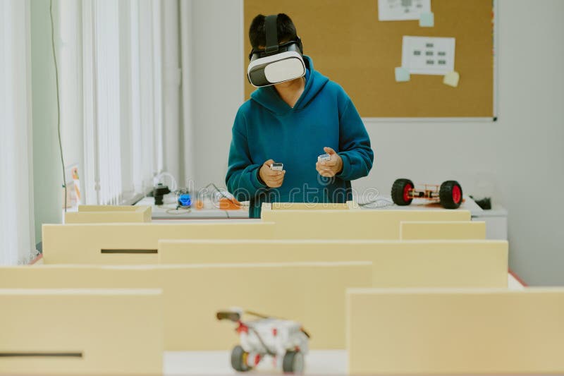 Student Holding Remote Controllers and Wearing VR Headset Stock Image ...