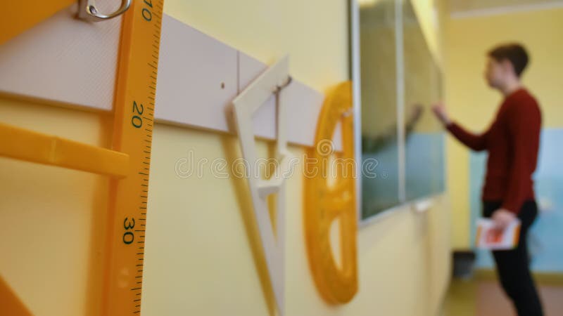 A Schoolboy Writes on the Blackboard during a Geometry Lesson. Geometry ...