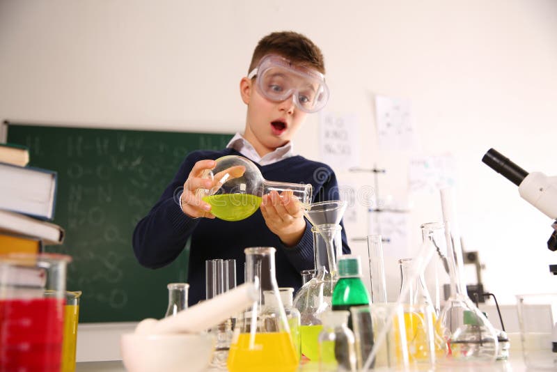 Schoolchild Making Experiment at Table in Class Stock Image - Image of ...