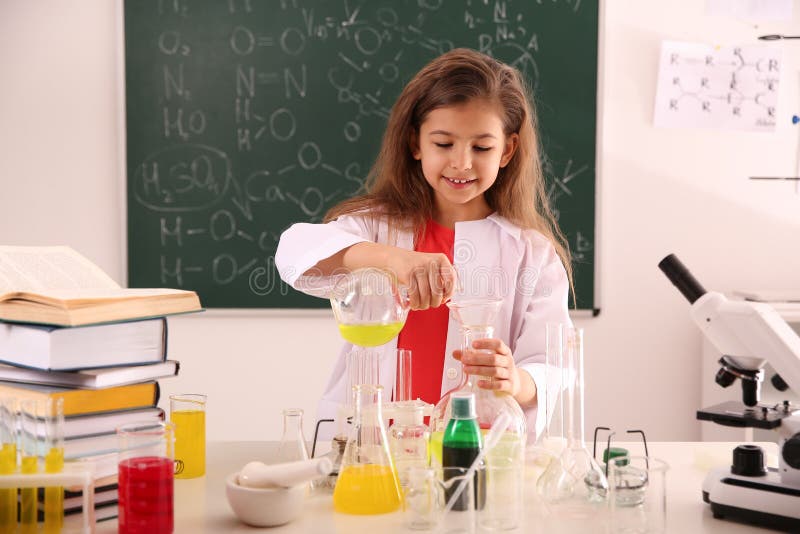 Schoolchild Making Experiment at Table in Class Stock Image - Image of ...