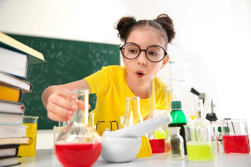 Schoolchild Making Experiment at Table in Class Stock Image - Image of ...