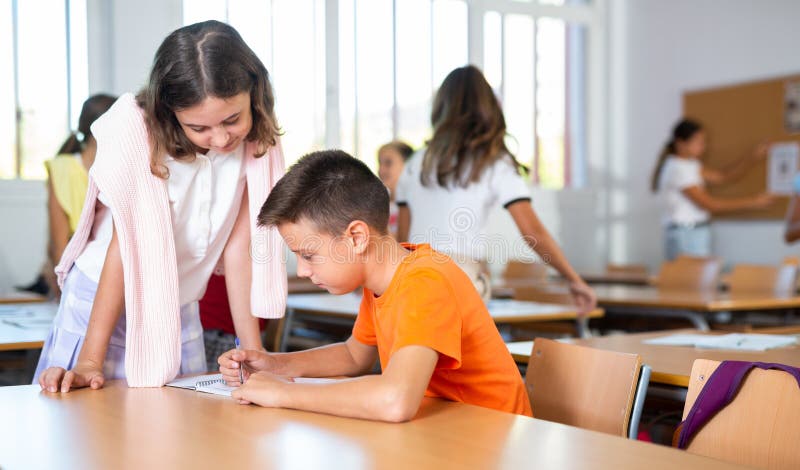 Schoolchildren Help Each Other Solve the Task in Classroom Stock Photo ...