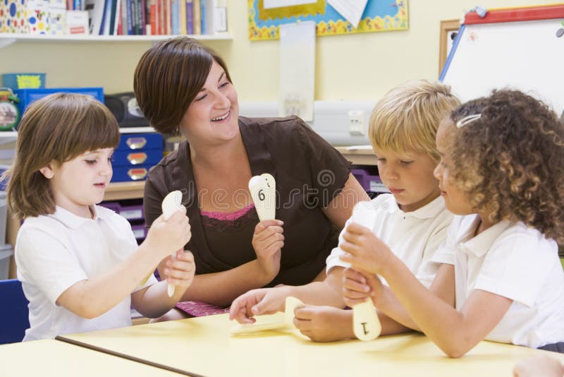 Schoolchildren Learning Numbers with Their Teacher Stock Photo - Image ...