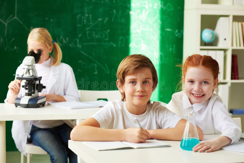 Schoolchildren at lesson stock image. Image of intelligent - 45161221