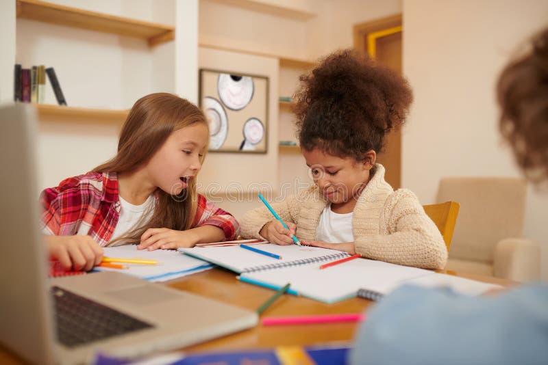 Schoolchildren Preparing Lessons Together and Discussing the Tasks ...