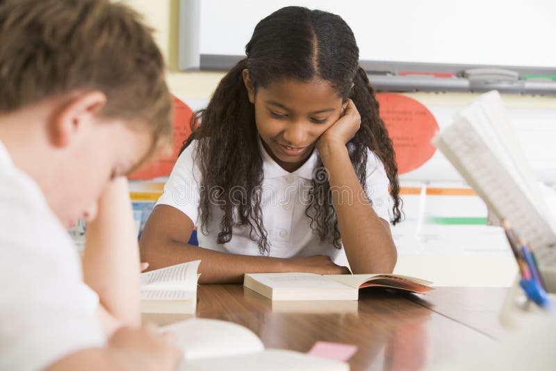Schoolchildren Reading Books in Class Stock Image - Image of colour ...