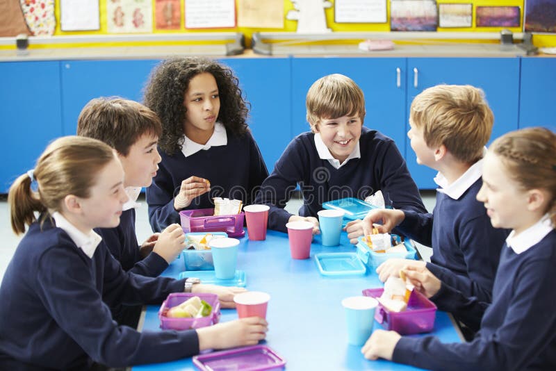 Schoolchildren Sitting at Table Eating Packed Lunch Stock Photo - Image ...