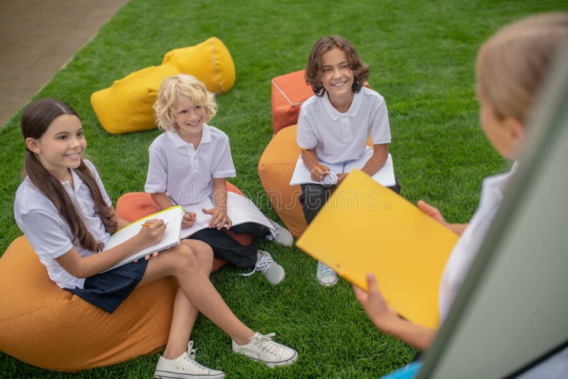 Listening to classmate stock photo. Image of school - 112380606