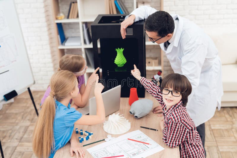Children Print Different Items on a 3d Printer with a Teacher. Stock ...