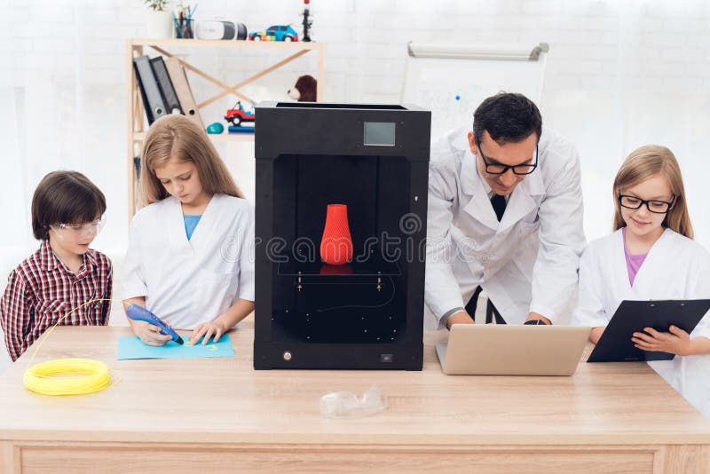 Children Print Different Items on a 3d Printer with a Teacher. Stock ...