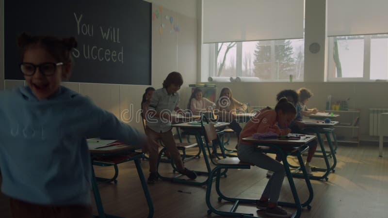 Schoolchildren Studying in School Class. Students Doing Class Work in ...