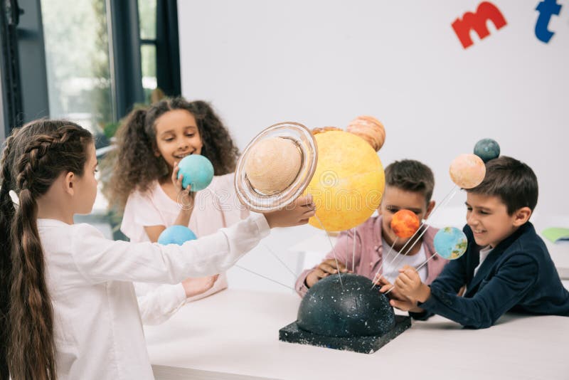Schoolchildren Working with Solar System Model in Classroom Stock Photo ...
