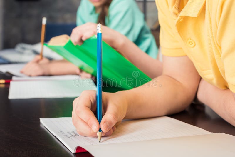 Schoolchildren Writing with Pencils Stock Image - Image of studying ...