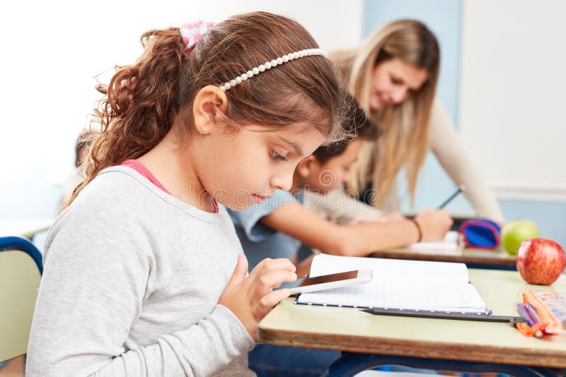 Schoolgirl Chatting in Class Stock Photo - Image of lessons, child ...
