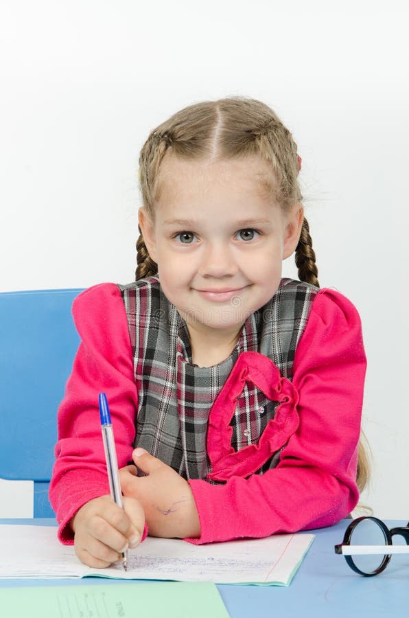 Schoolgirl do homework stock photo. Image of table, portrait - 55401060