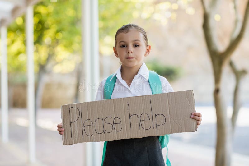 Schoolgirl Holding Placard Which Reads Please Help Stock Image - Image ...