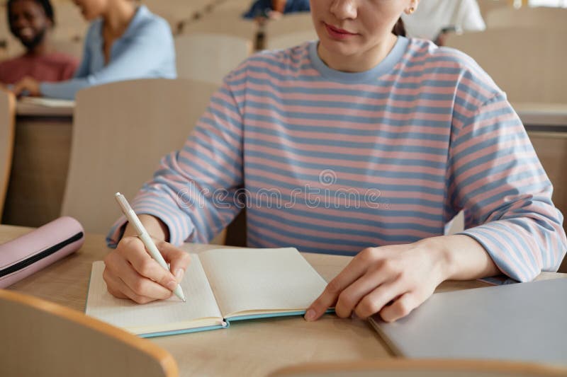 Schoolgirl Making Notes in Notebook at Lecture Stock Image - Image of ...