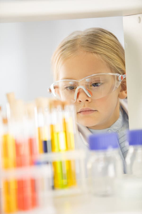 Schoolgirl in Protective Goggles Looking at Test Tubes Stock Photo ...