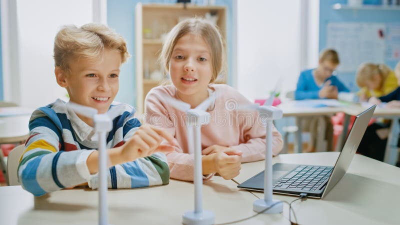 Schoolgirl and Schoolboy Work with Wind Turbine Prototype, Learning ...