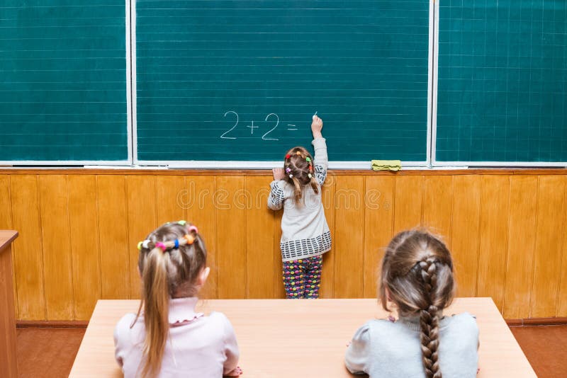 Schoolgirl Solves an Example of Math Stock Photo - Image of mathematics ...