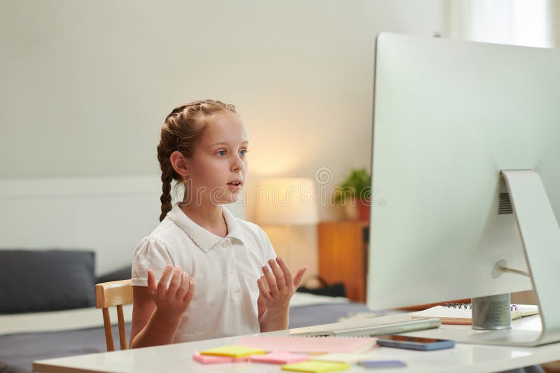 Schoolgirl Speaking in Front of Computer Stock Image - Image of ...