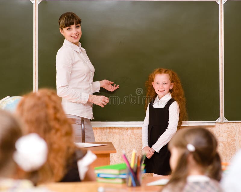 Schoolgirl and Teacher Near a School Board Stock Photo - Image of ...