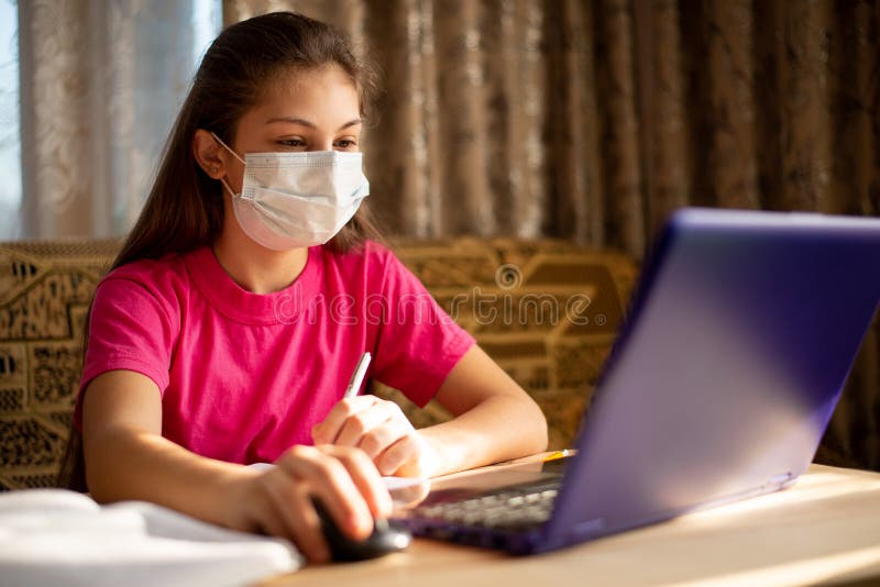Schoolgirl Working at Home in the Time of Coronavirus Quarantine Stock ...