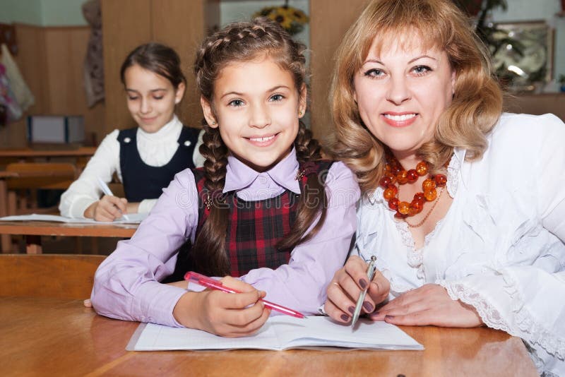 Schoolgirls and teacher stock image. Image of kids, junior - 73433583